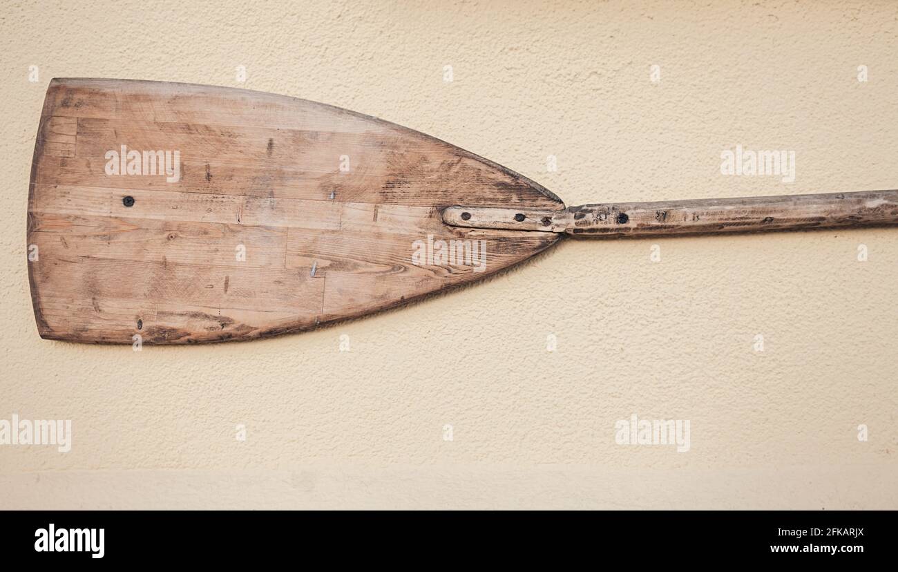 Old wooden canoe paddle on the wall. vintage design Stock Photo - Alamy