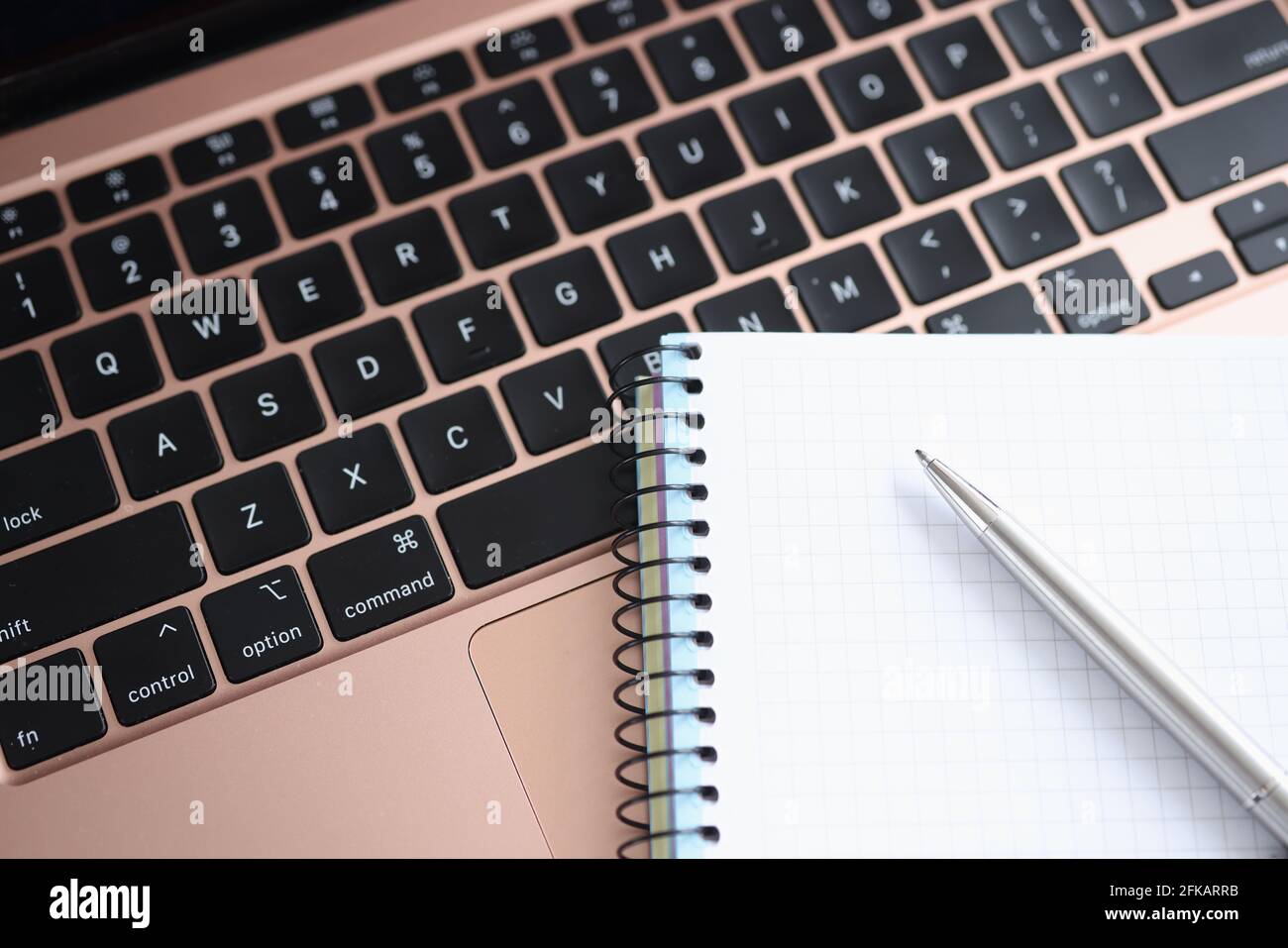 Spiral notepad and ballpoint pen lying on laptop keyboard closeup Stock ...