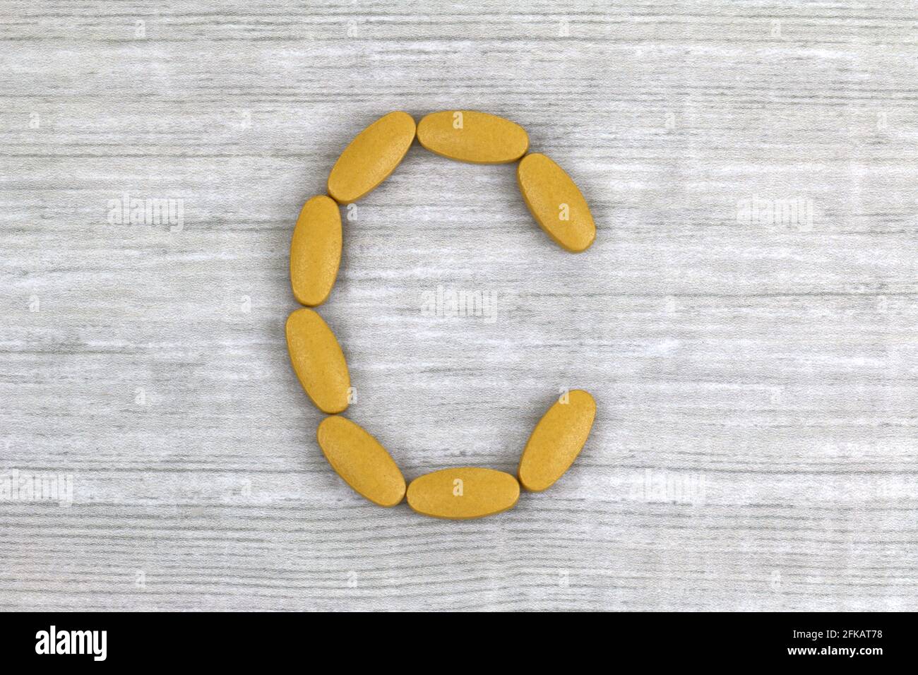 High potency Ascorbic Acid, Vitamin C tablets in a shape of C alphabet ...