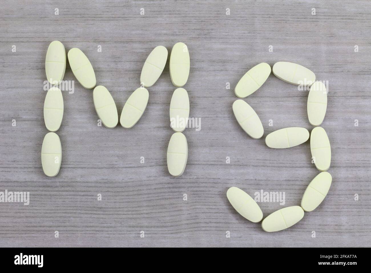 Magnesium tablets in a shape of Mg alphabet, to relieves muscle cramps ...