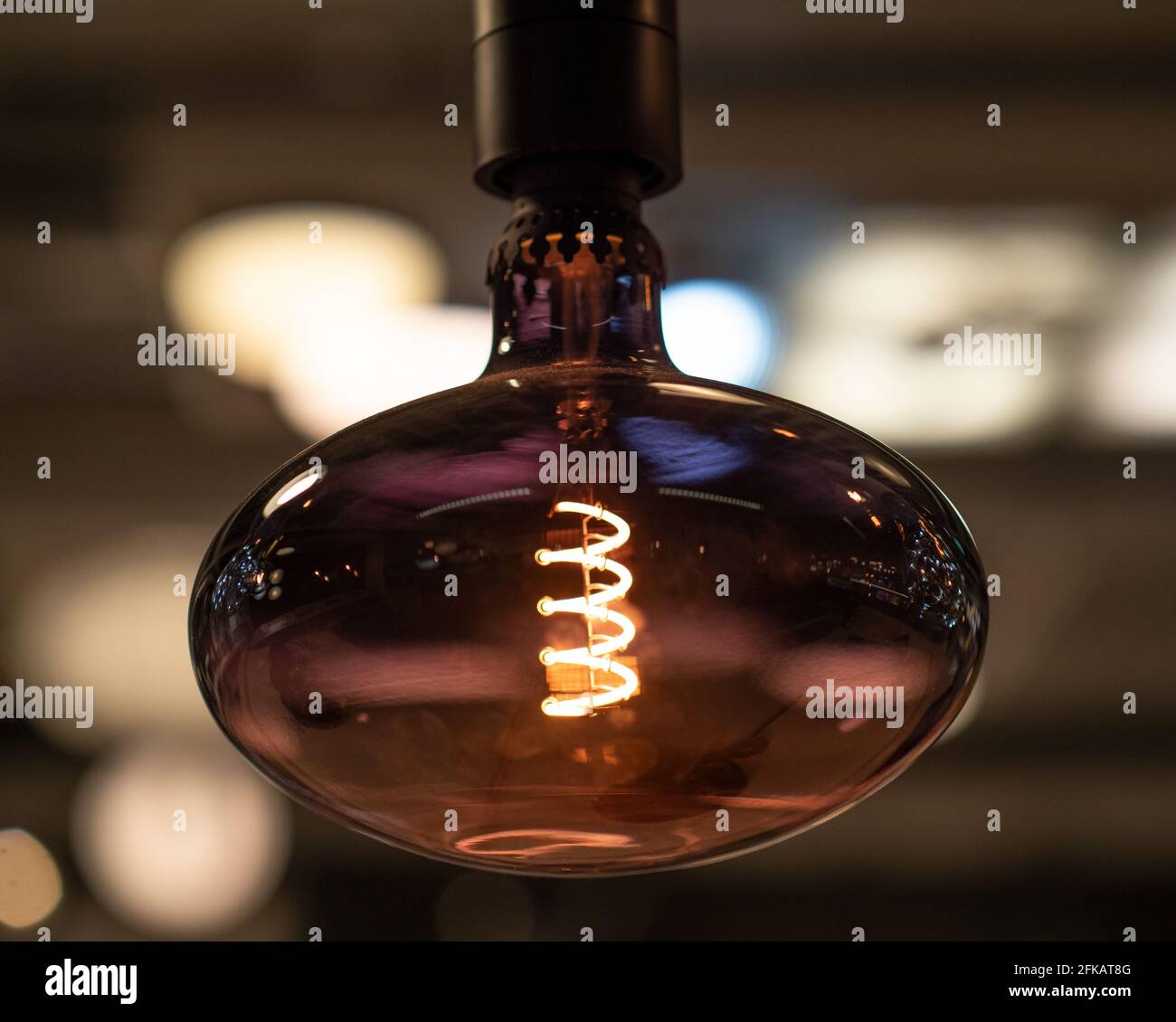 ornamental dark glass led lamp, city lights background Stock Photo - Alamy