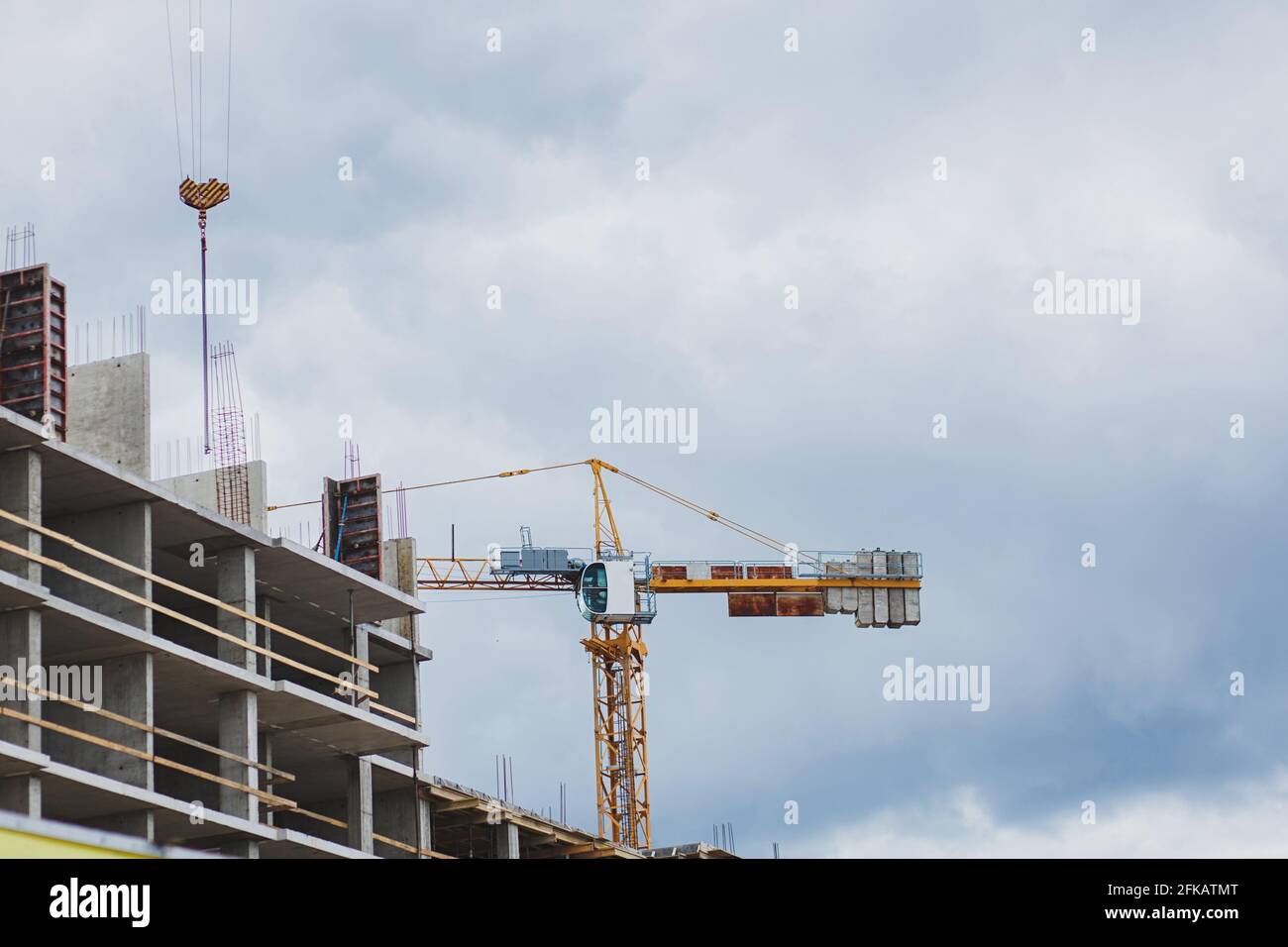 Under construction high-rise building with construction crane Stock ...