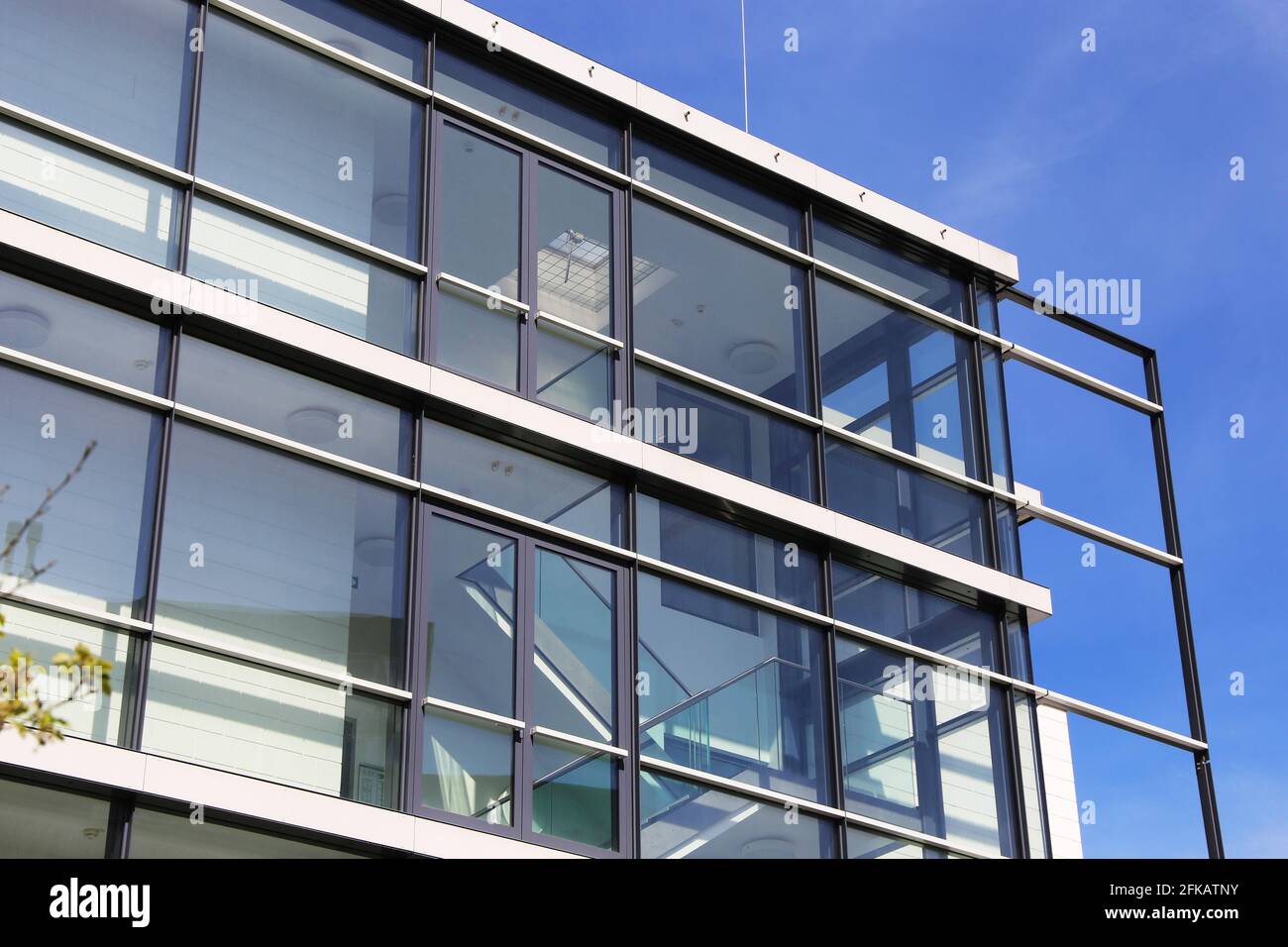 Building with large and modern glass facade Stock Photo - Alamy
