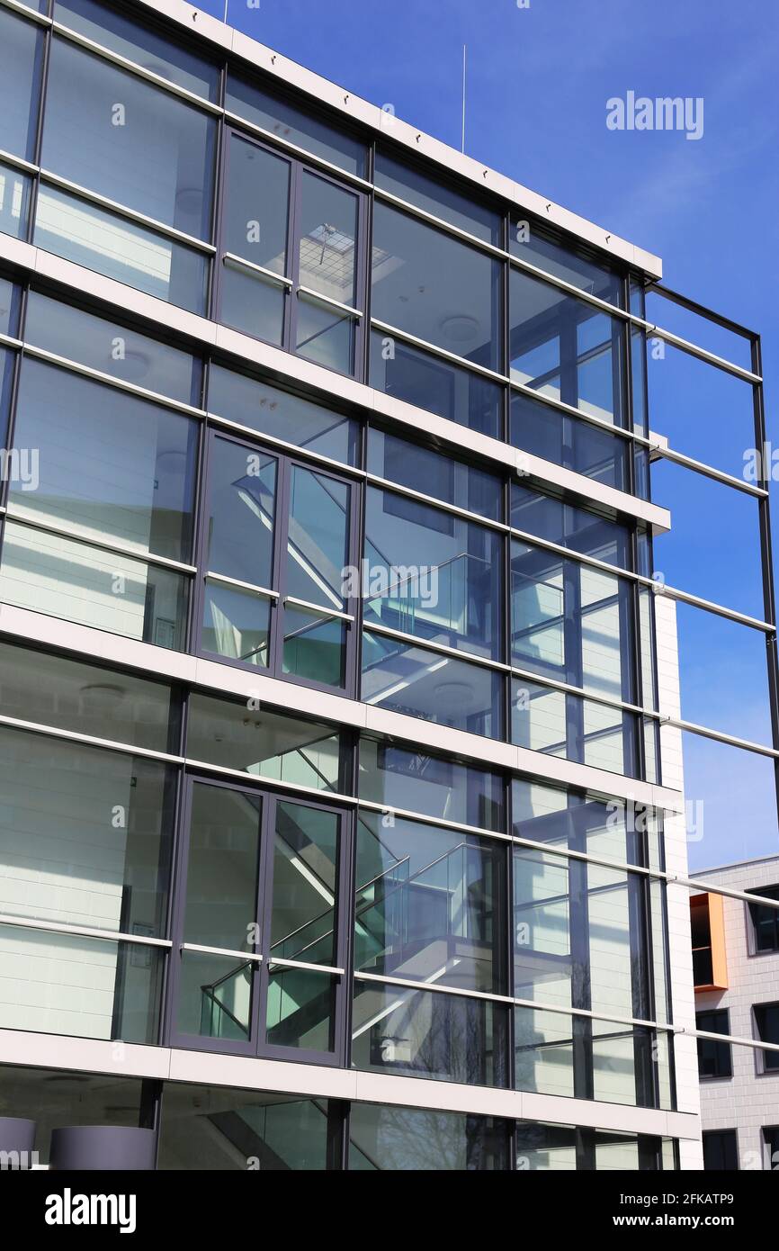 Building with large and modern glass facade Stock Photo - Alamy