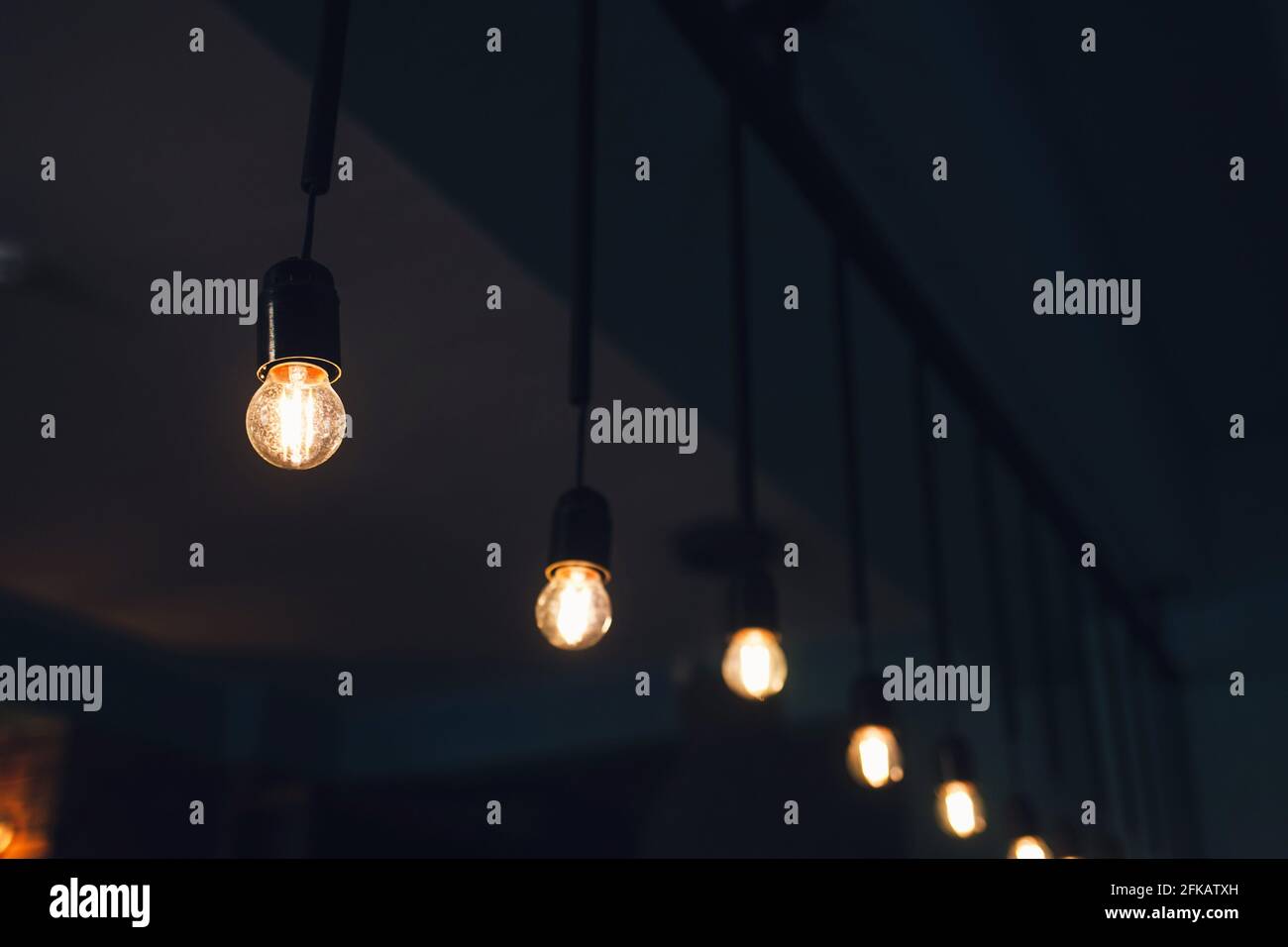 a row of old vintage light bulbs in the restaurant room Stock Photo - Alamy