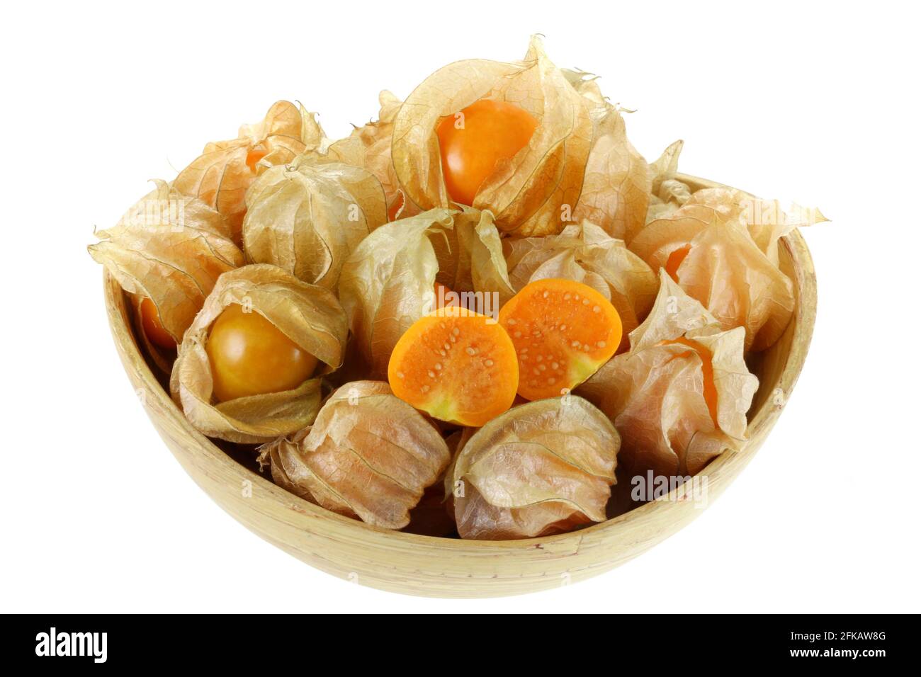 Fresh Cape Gooseberry cut in half in a wooden bowl isolated on white ...
