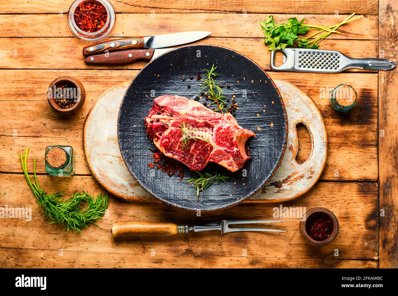 Raw beef meat with rosemary and spices Stock Photo - Alamy