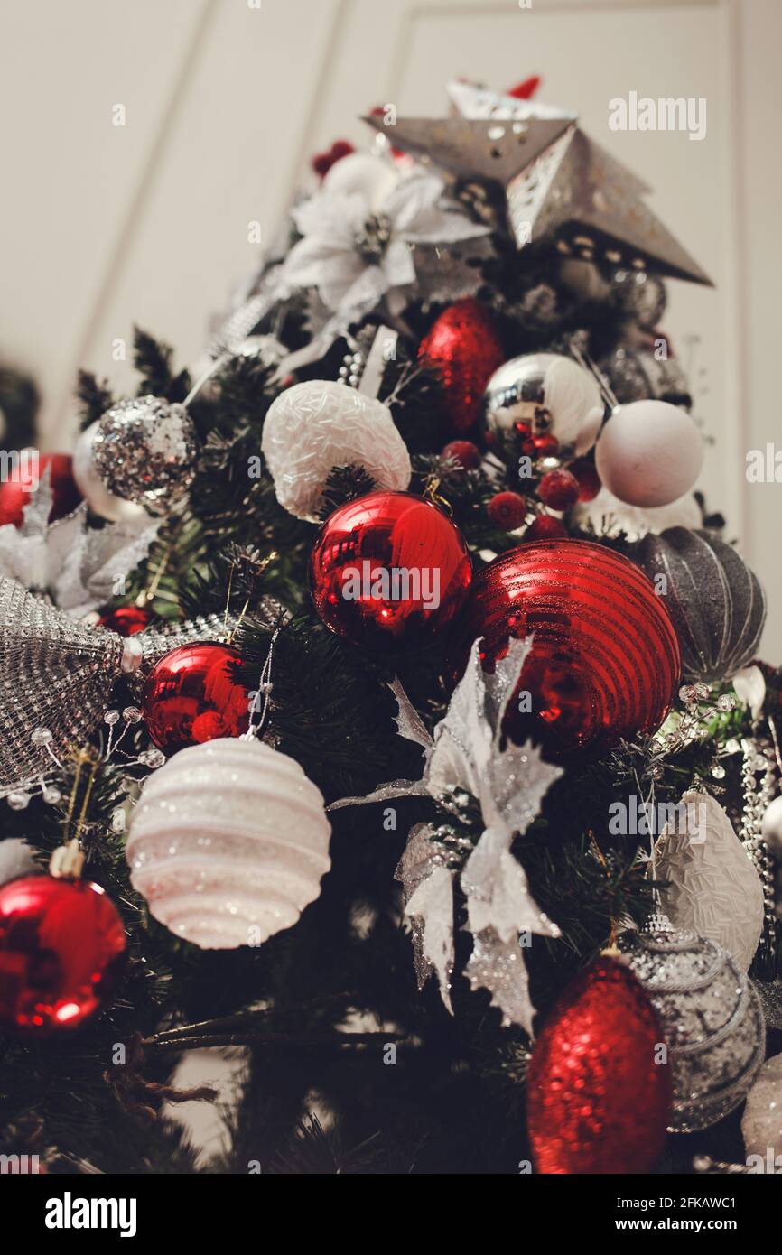 Christmas tree with garlands and star Stock Photo - Alamy