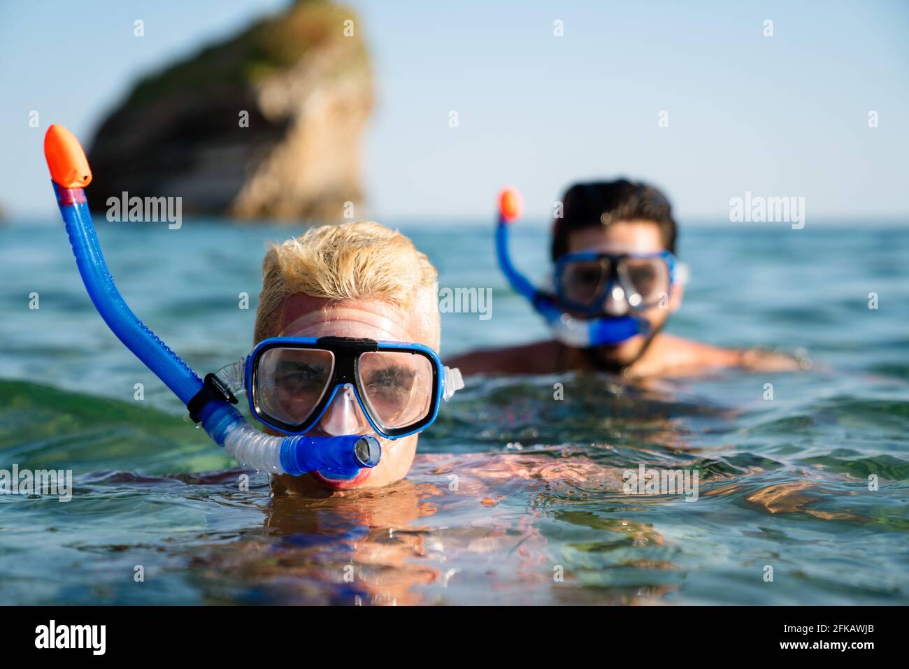 Happy friends enjoying summer vacation, travel during scuba diving ...