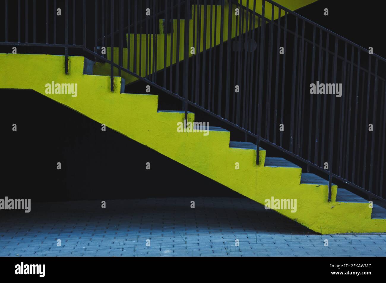 yellow steps in the parking lot. emergency exit Stock Photo - Alamy