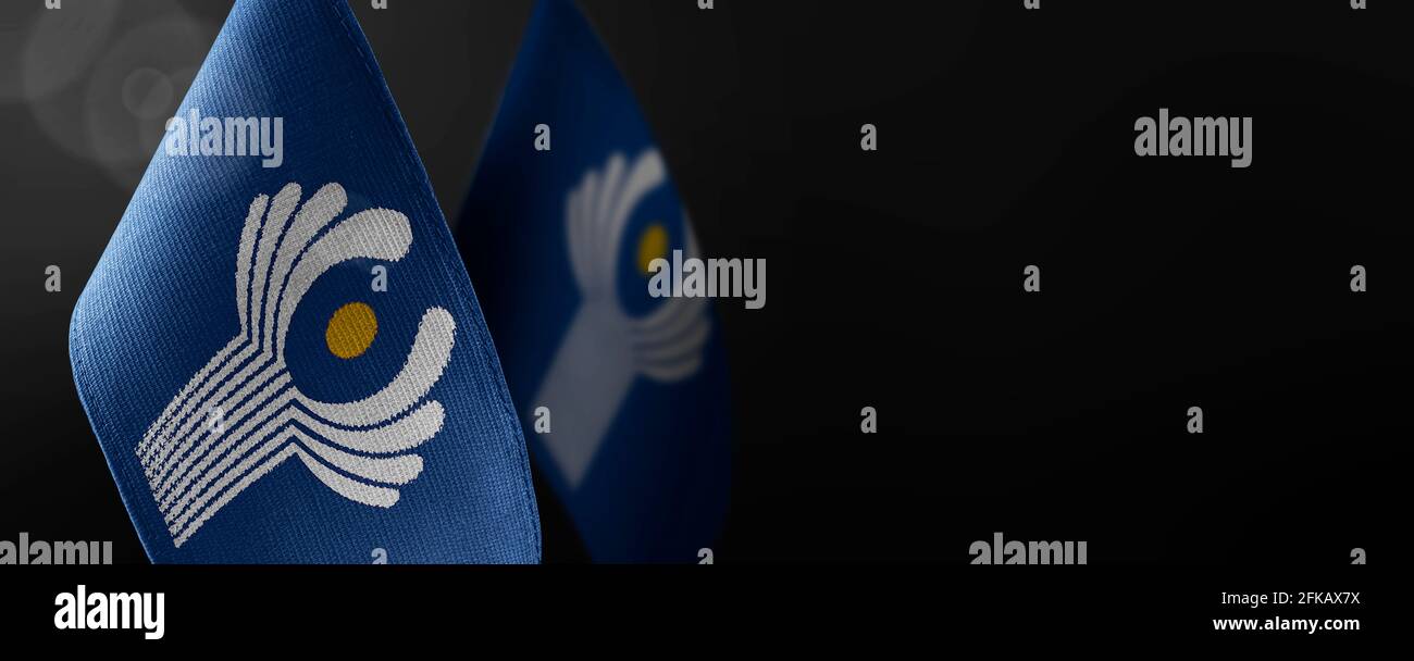Small national flags of the CIS on a dark background Stock Photo - Alamy