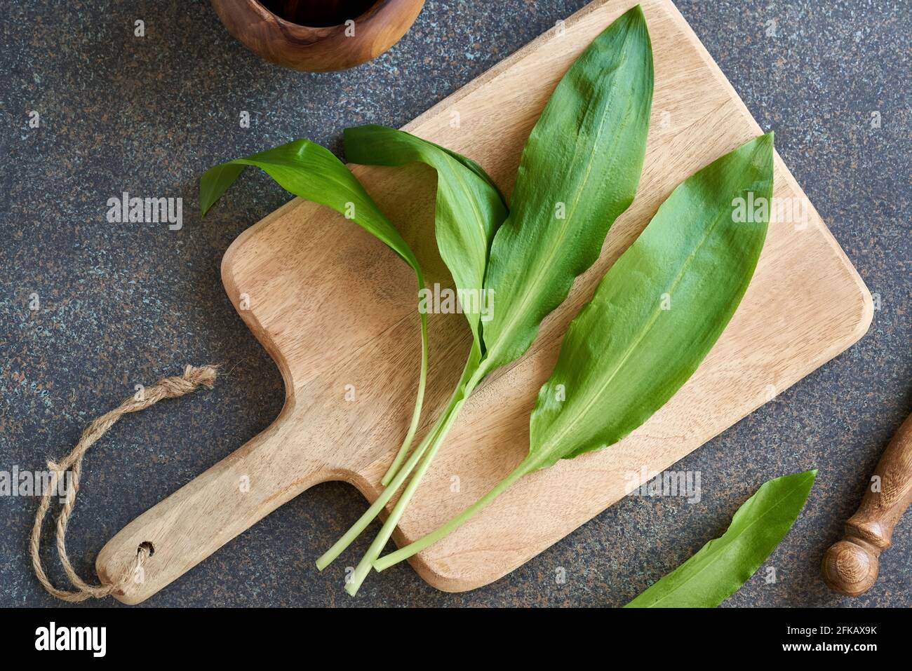 Fresh wild garlic leaves on a table, top view Stock Photo - Alamy