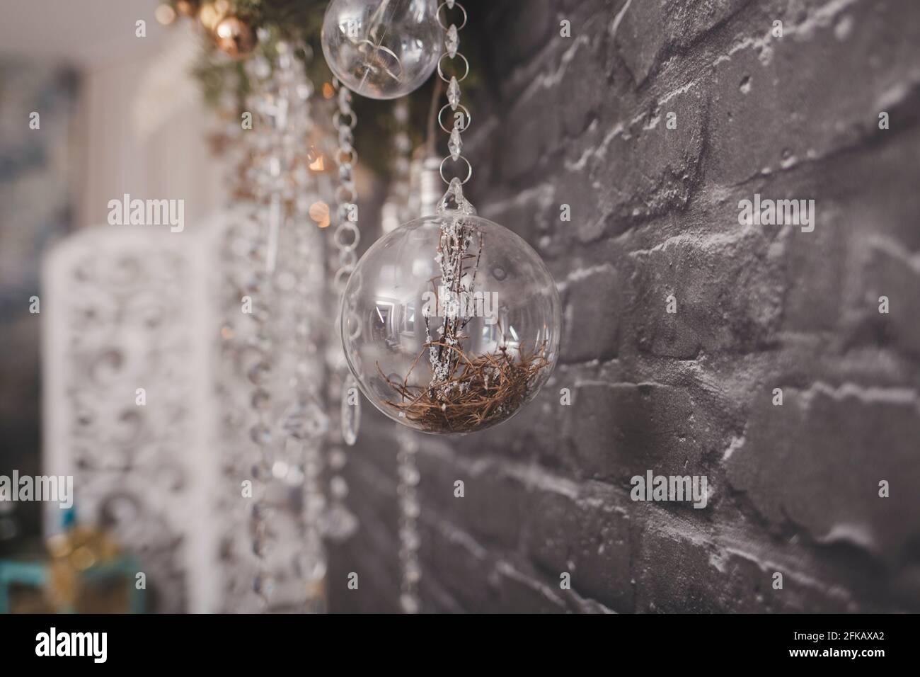 close-up of a christmas light bulb hanging on the wall in the living ...