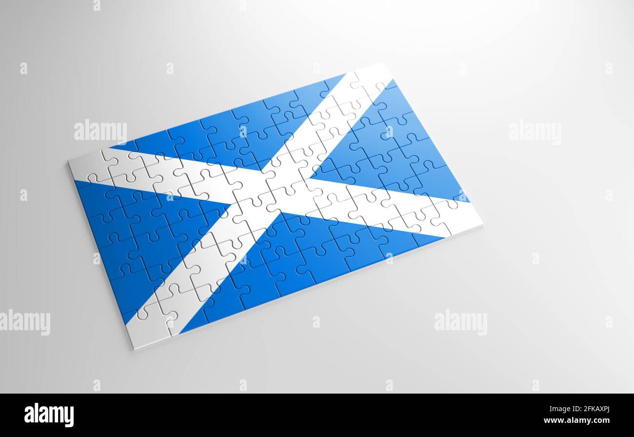 A jigsaw puzzle with a print of the flag of Scotland, pieces of the ...