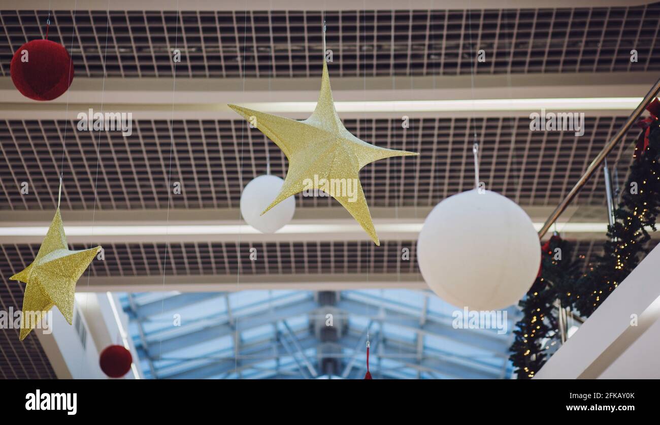 hanging Christmas stars in the interior of the shopping center Stock ...