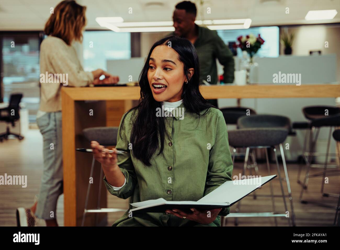 passionate business woman instructing clients briefing them for ...