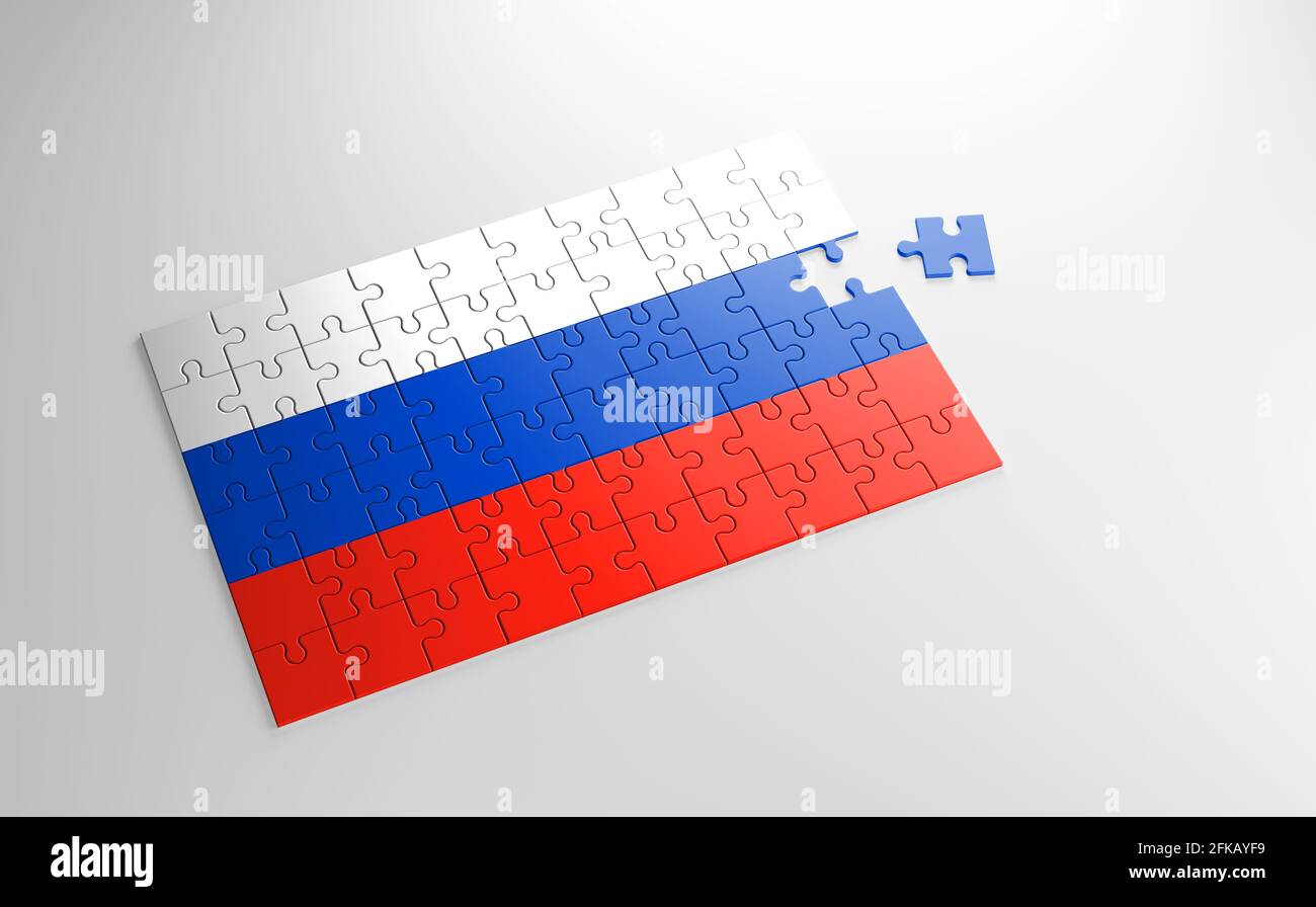 A jigsaw puzzle with a print of the flag of Russia, pieces of the ...