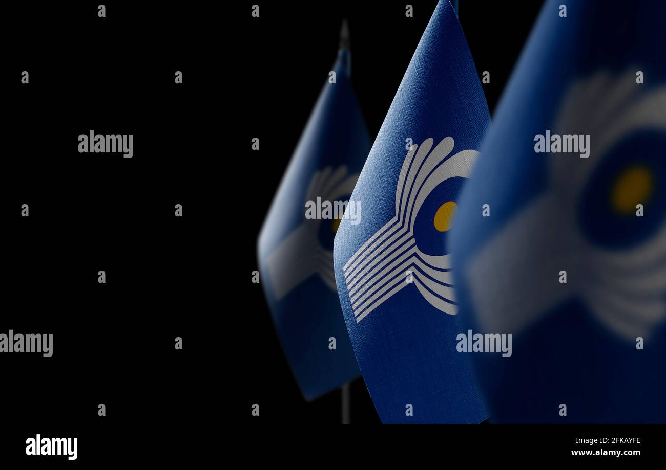 Small national flags of the CIS on a dark background Stock Photo - Alamy