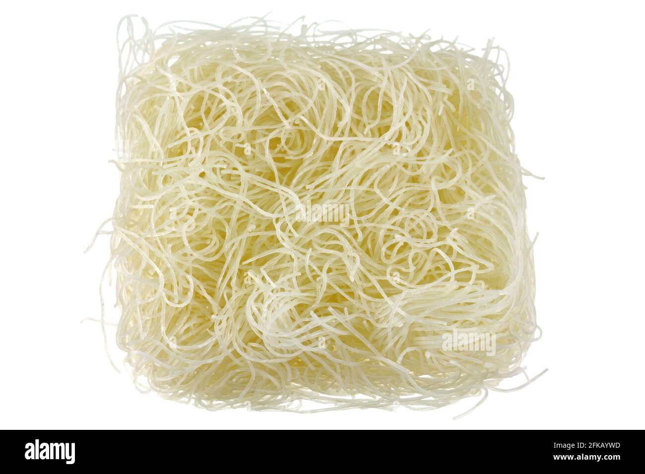 A block of dried Instant rice vermicelli noodles isolated on a white ...