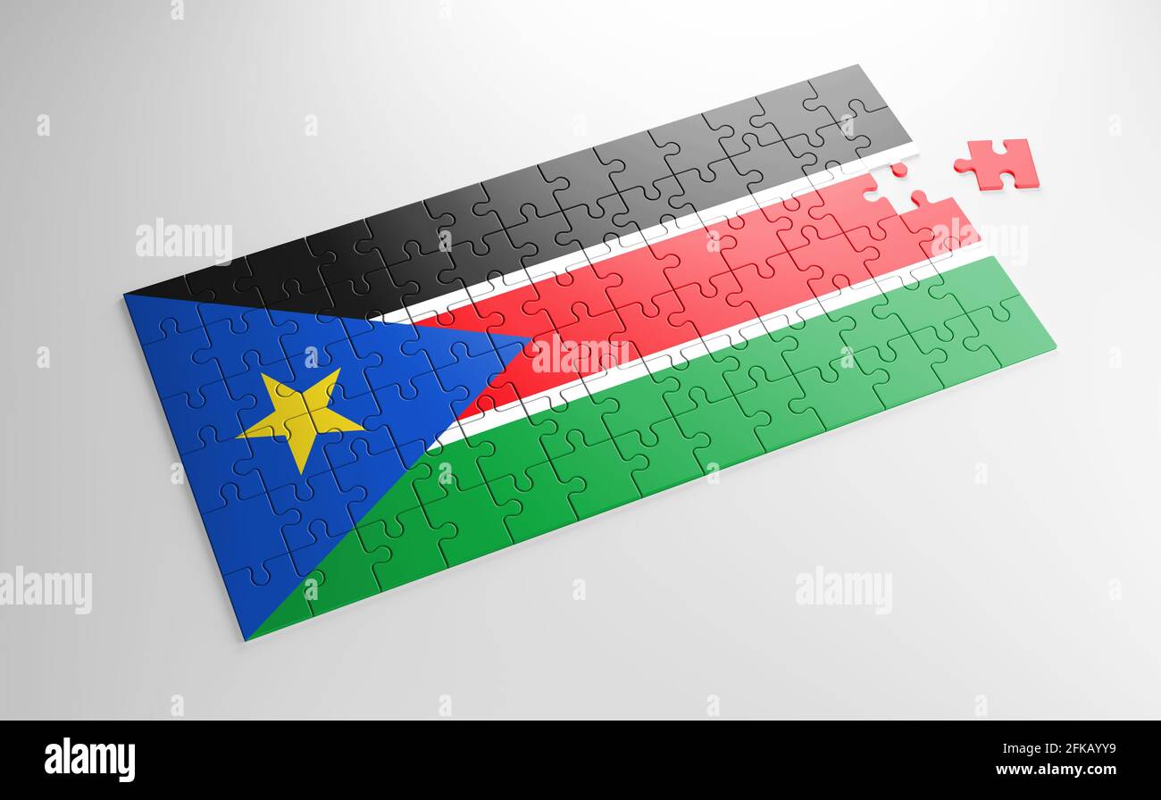 A jigsaw puzzle with a print of the flag of South Sudan, pieces of the ...