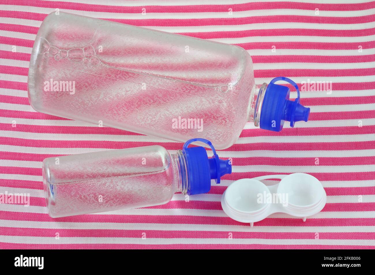 Bottles of Multi-Purpose Contact Lens Solution and a lens case Stock ...