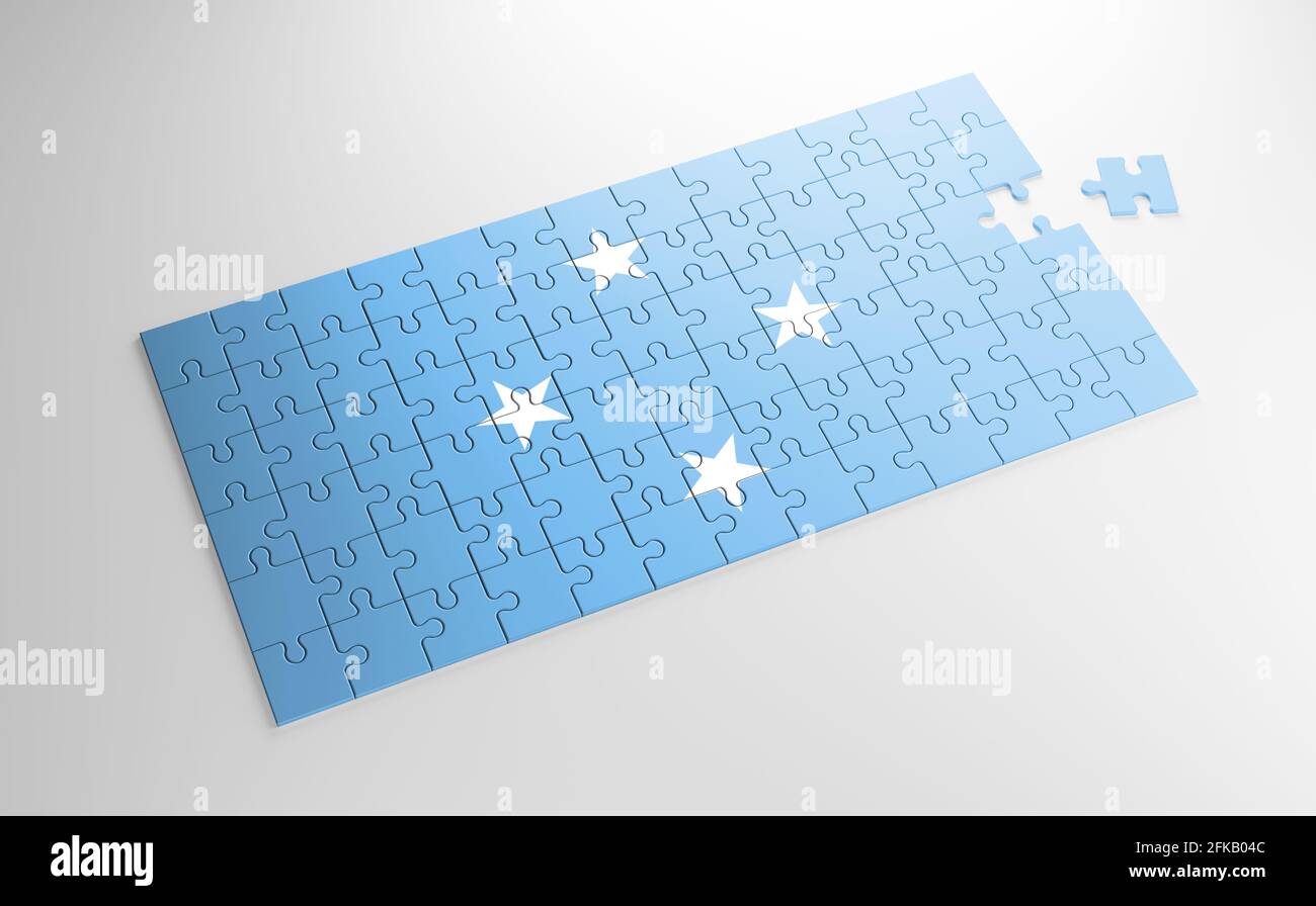 A jigsaw puzzle with a print of the flag of Micronesia, pieces of the ...