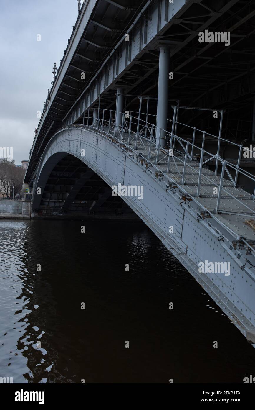 City bridge over the river vertical photography, close-up. Metallic ...