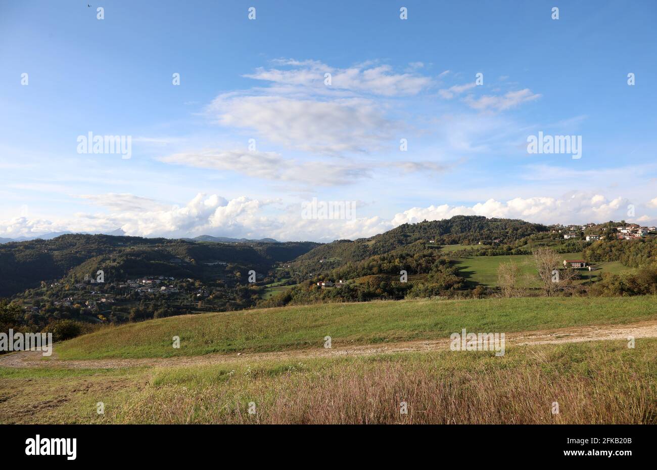 large hill landscape with meadows and rolling hills in a sunny day ...