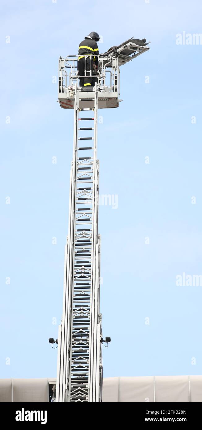 basket of the ladder truck with the fire brigade during the rescue ...