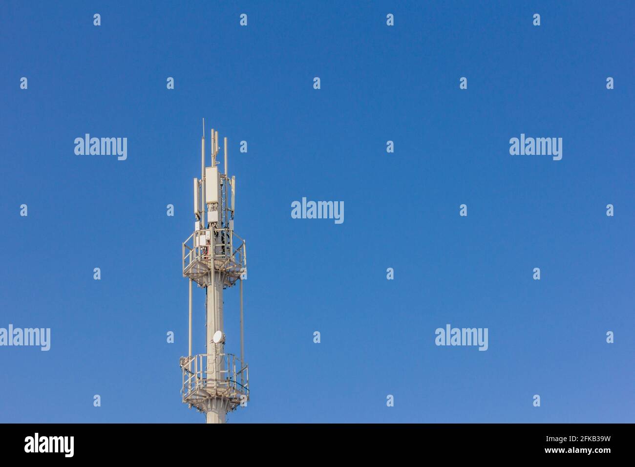 cell tower transmitting signals of mobile phone and Internet against ...