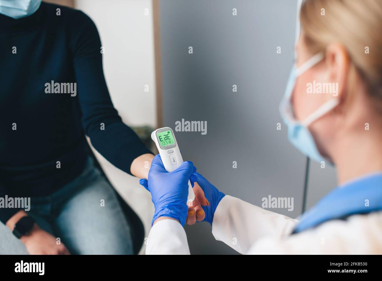 Close up photo of a caucasian senior doctor using a electronic ...