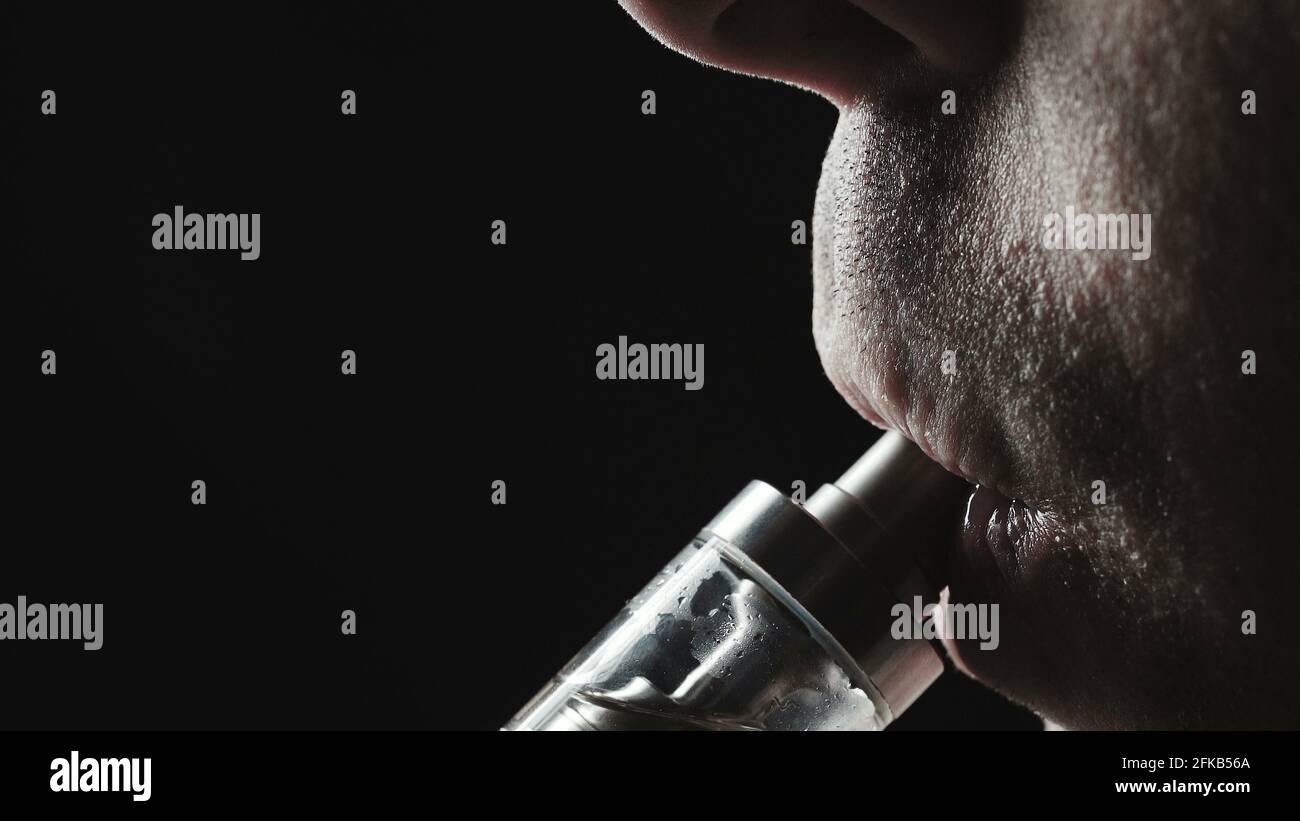 Closeup photo of smoker man with e-cigarette Stock Photo - Alamy