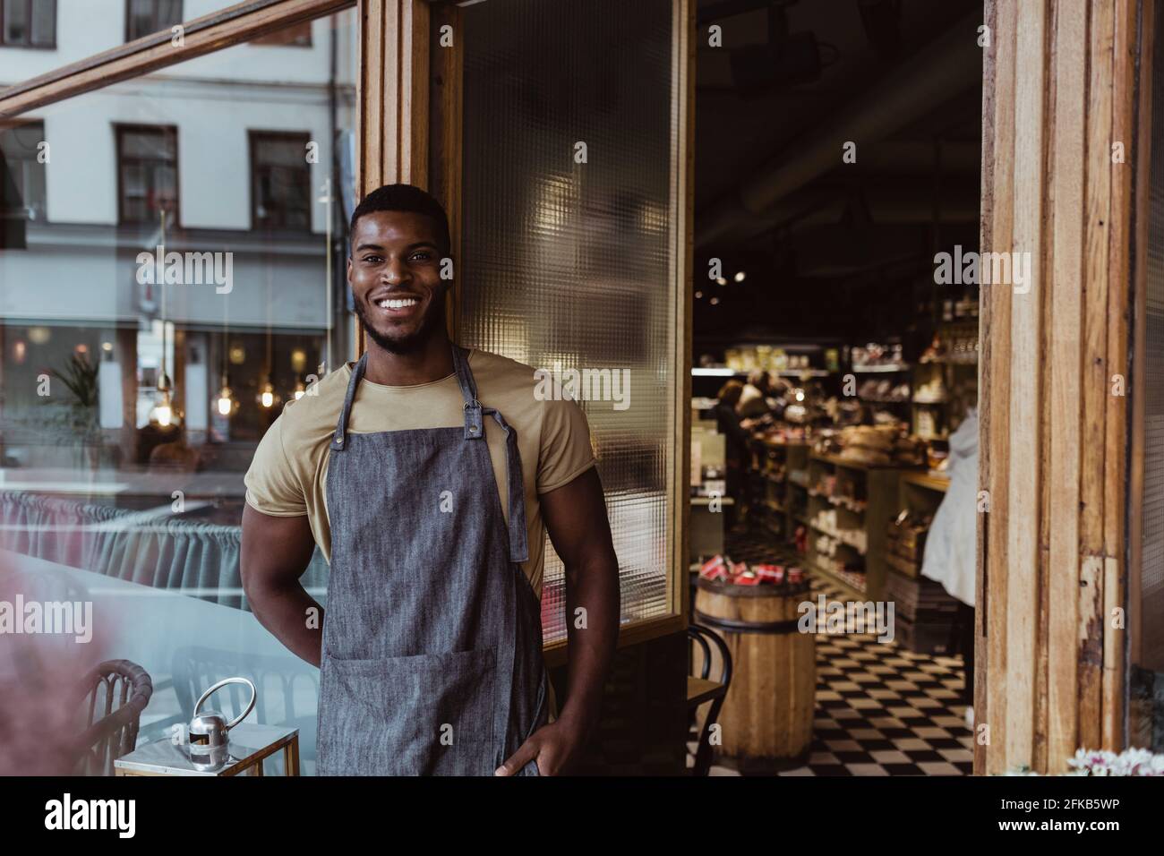 Portrait of smiling male owner standing outside store Stock Photo - Alamy