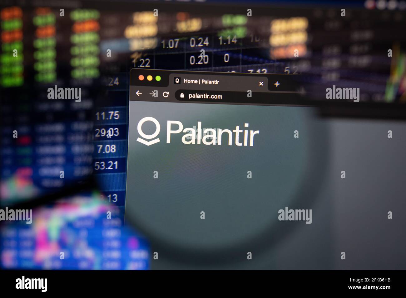 Palantir company logo on a website with blurry stock market ...