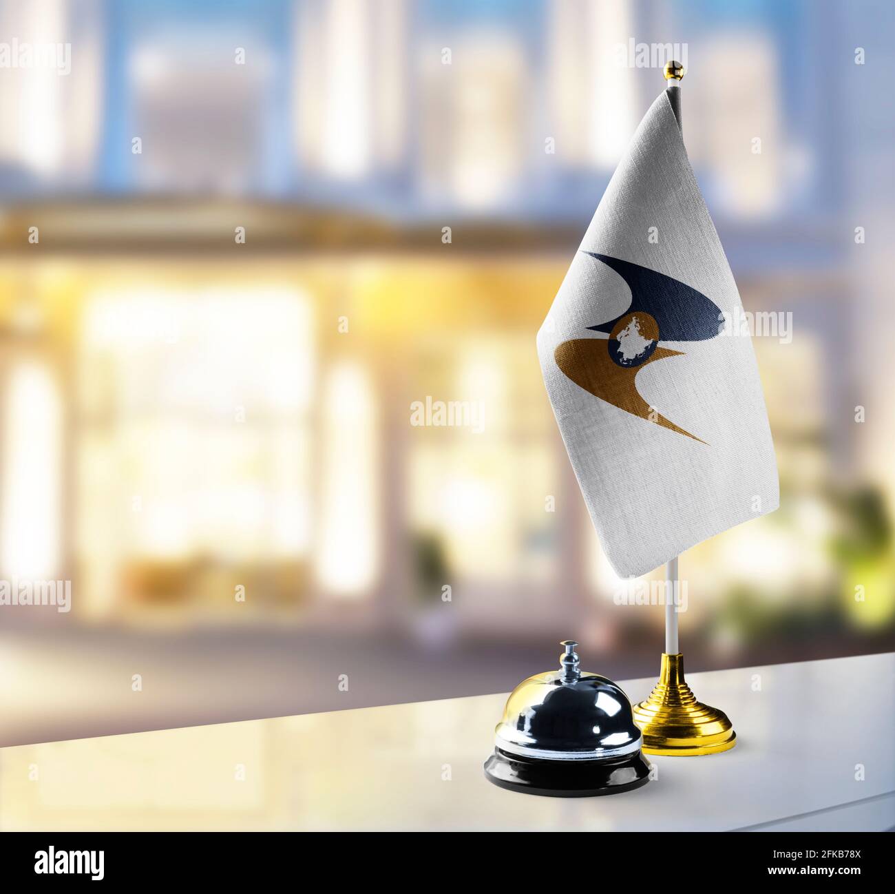 Eurasian Economic Union flag on the reception desk in the lobby of the ...