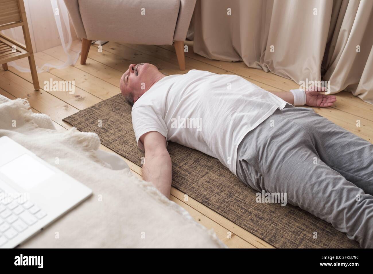 Old man lying floor hi-res stock photography and images - Alamy