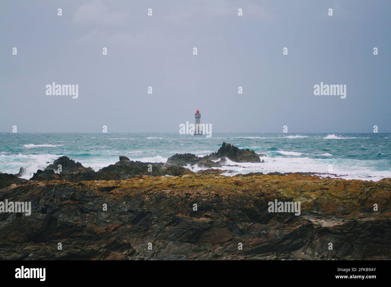 red lighthouse in the ocean. Brittany, France Stock Photo - Alamy