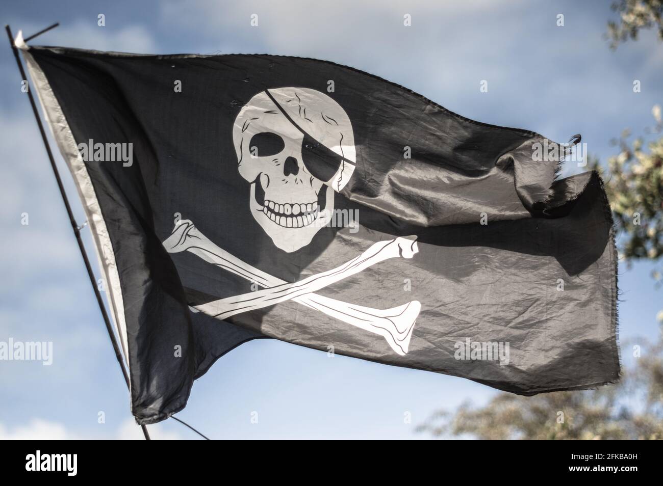 A Jolly Roger flag flying above a narrowboat in London, UK Stock Photo ...