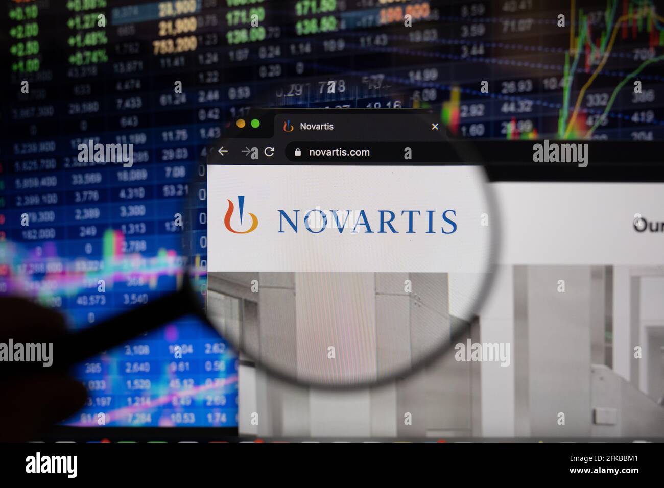 Novartis company logo on a website with blurry stock market developments in the background, seen ...