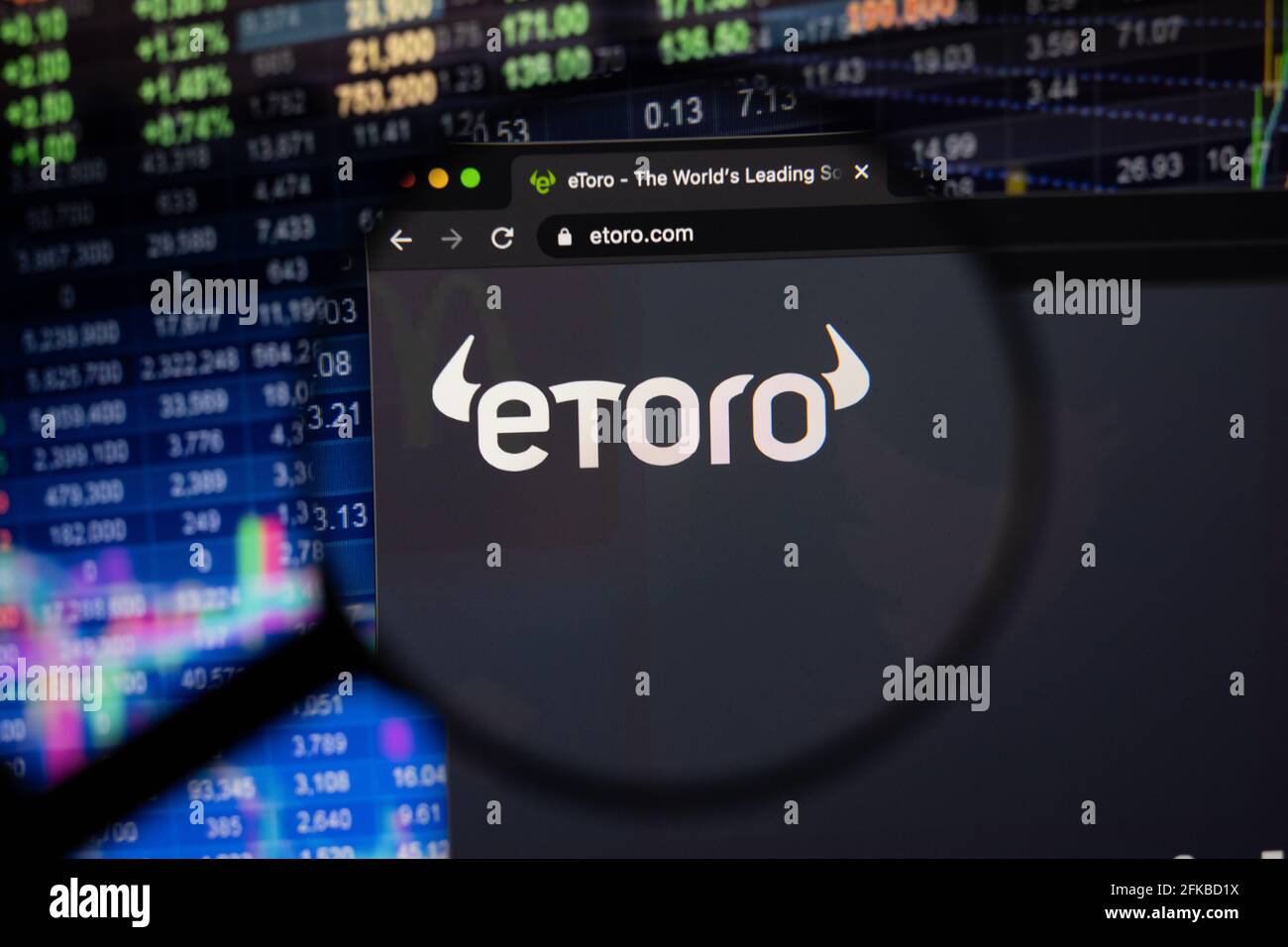 eToro company logo on a website with blurry stock market developments ...