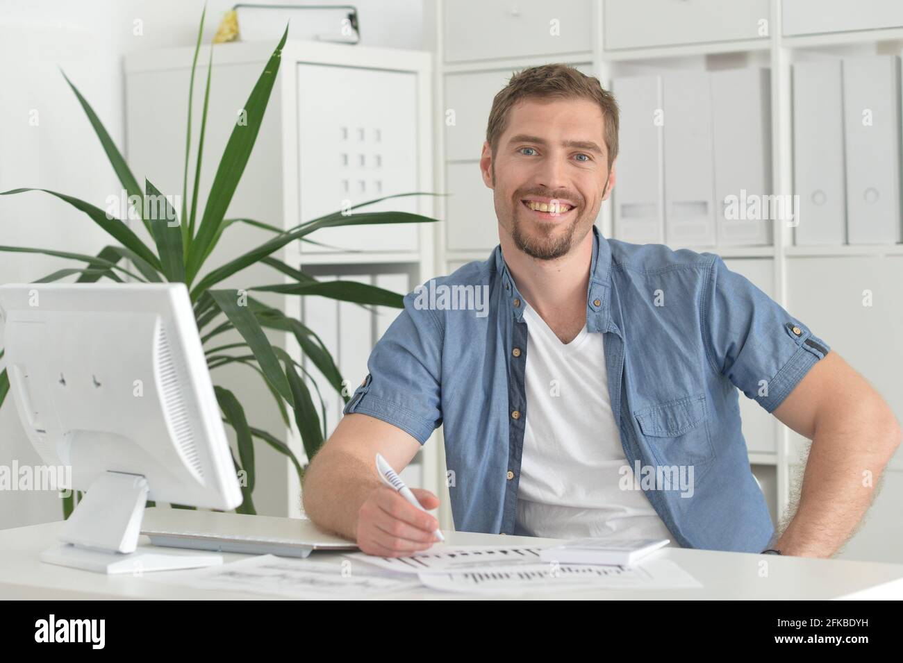 Man using computer in office hi-res stock photography and images - Alamy
