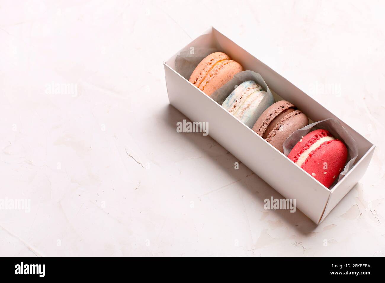 French macaroon sweets, different tastes & colors. Box of macarons on ...