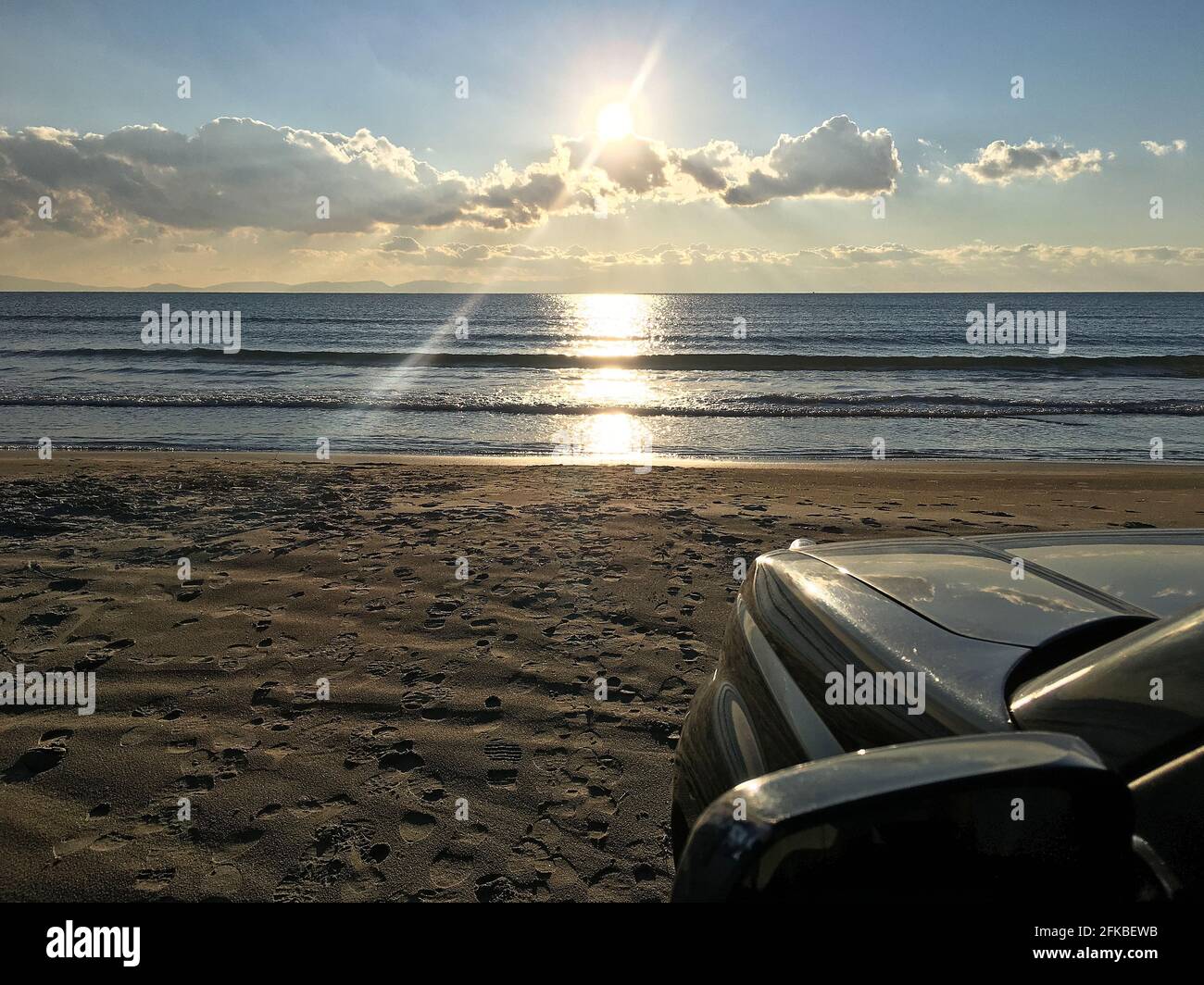Off road car at the beach before sunset Stock Photo - Alamy