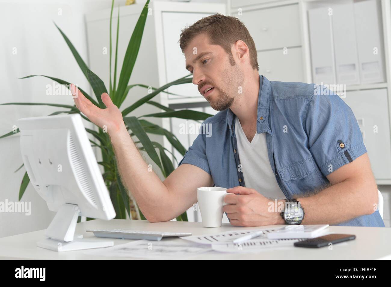 Man using computer in office hi-res stock photography and images - Alamy