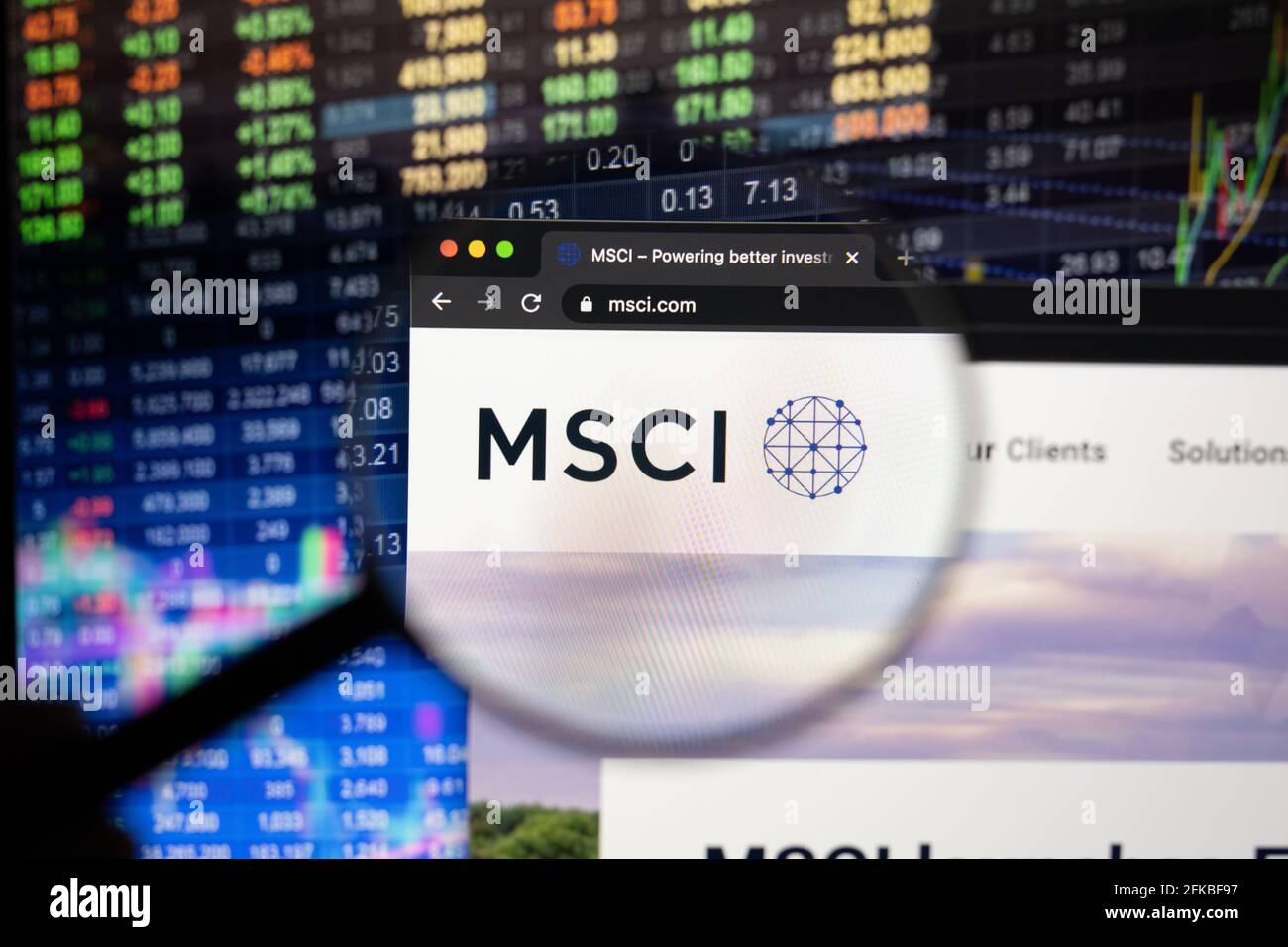 MSCI company logo on a website with blurry stock market developments in ...