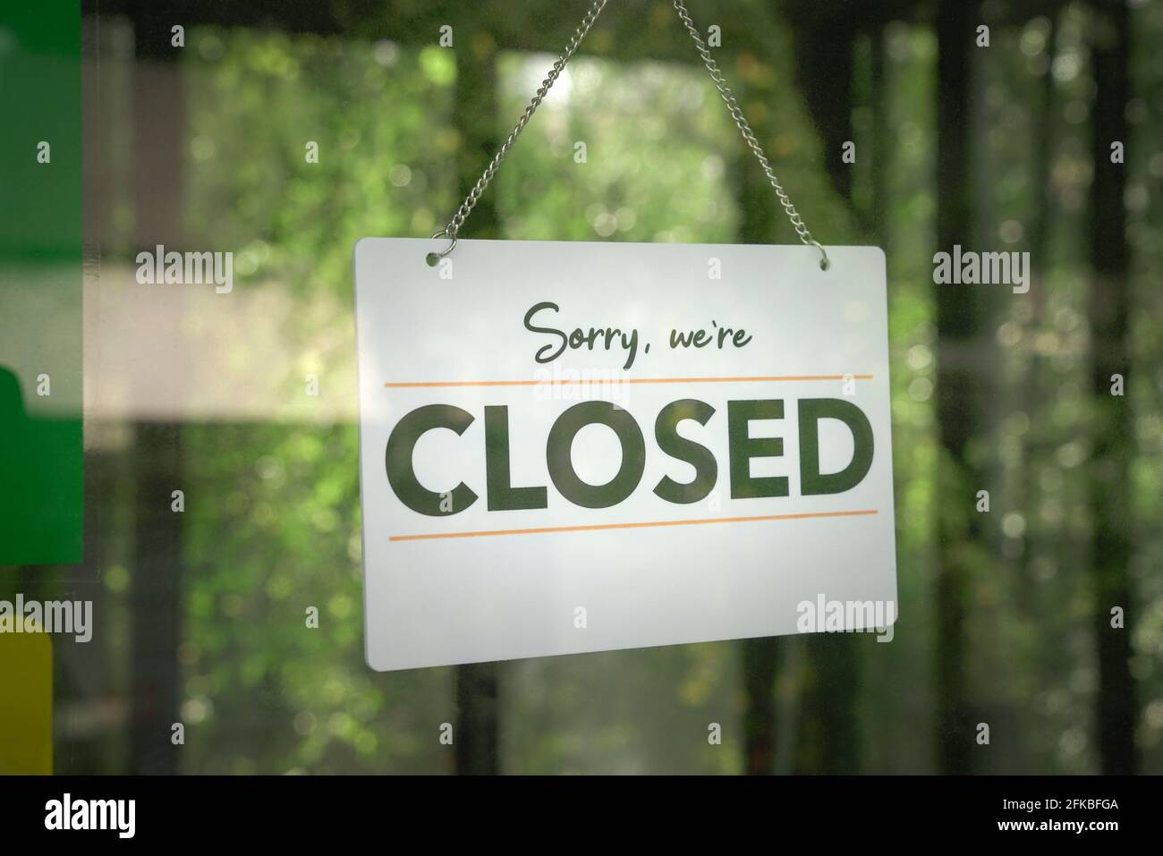 Signboard, Sorry We Are Closed hanging on the door front of a shop ...