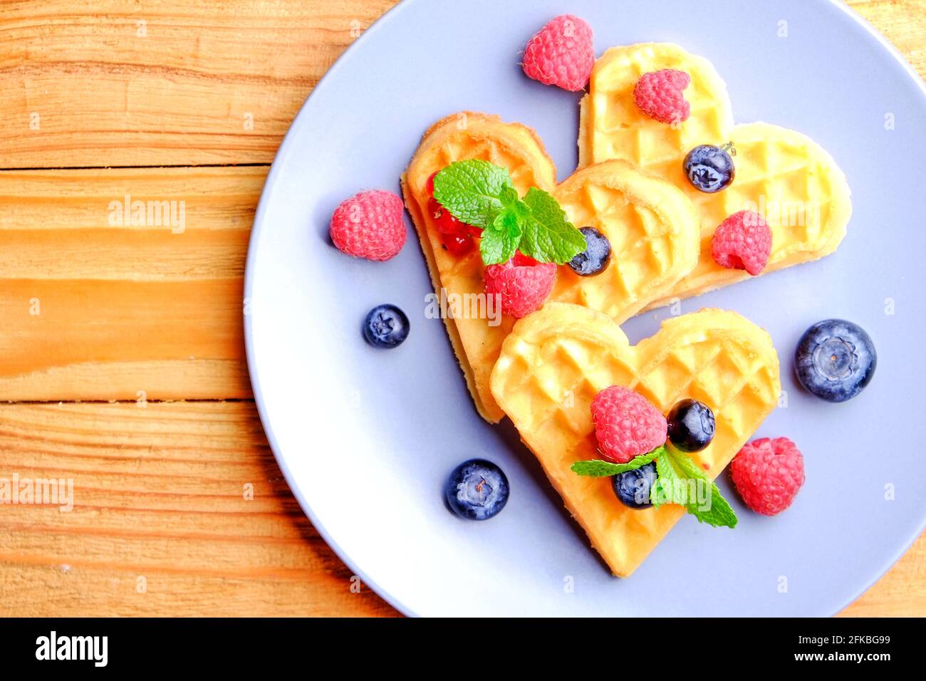 Heart shape belgium waffles with assorted berries mix, strawberry ...