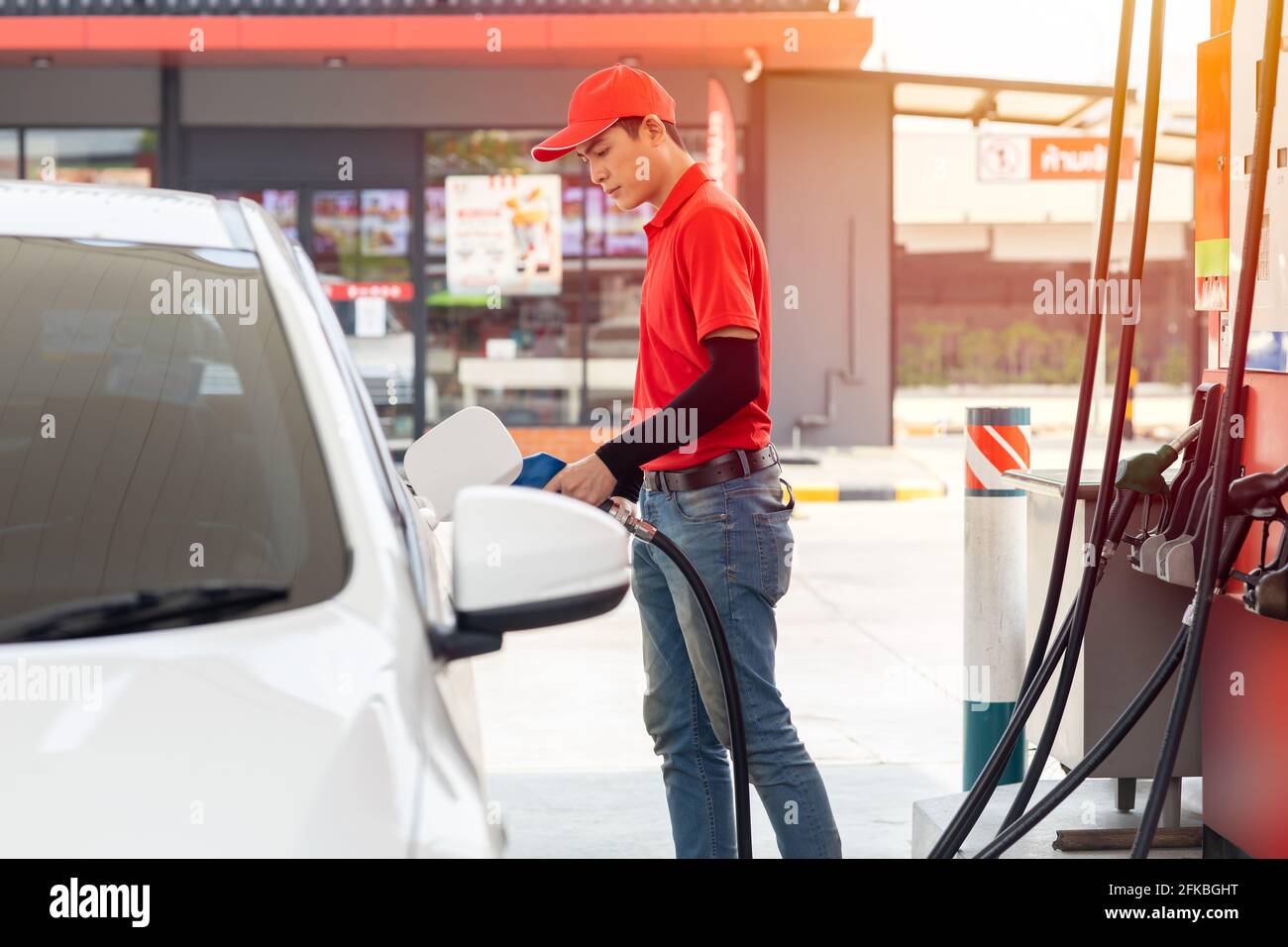 Gas station male man worker staff happy service working refill car ...