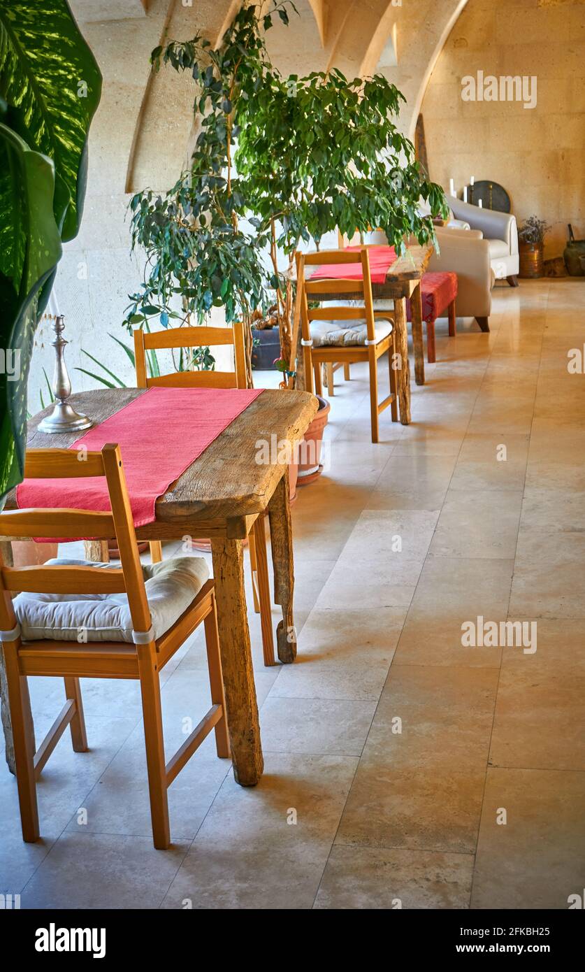 Beautiful interior decoration with wooden tables and chairs Stock Photo ...