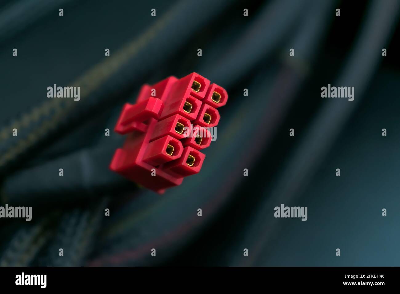 Red plug or connector from a power supply for motherboards of a ...